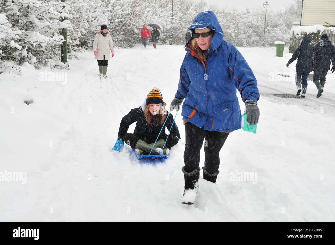 Woman pulling sled hi-res stock photography and images - Alamy