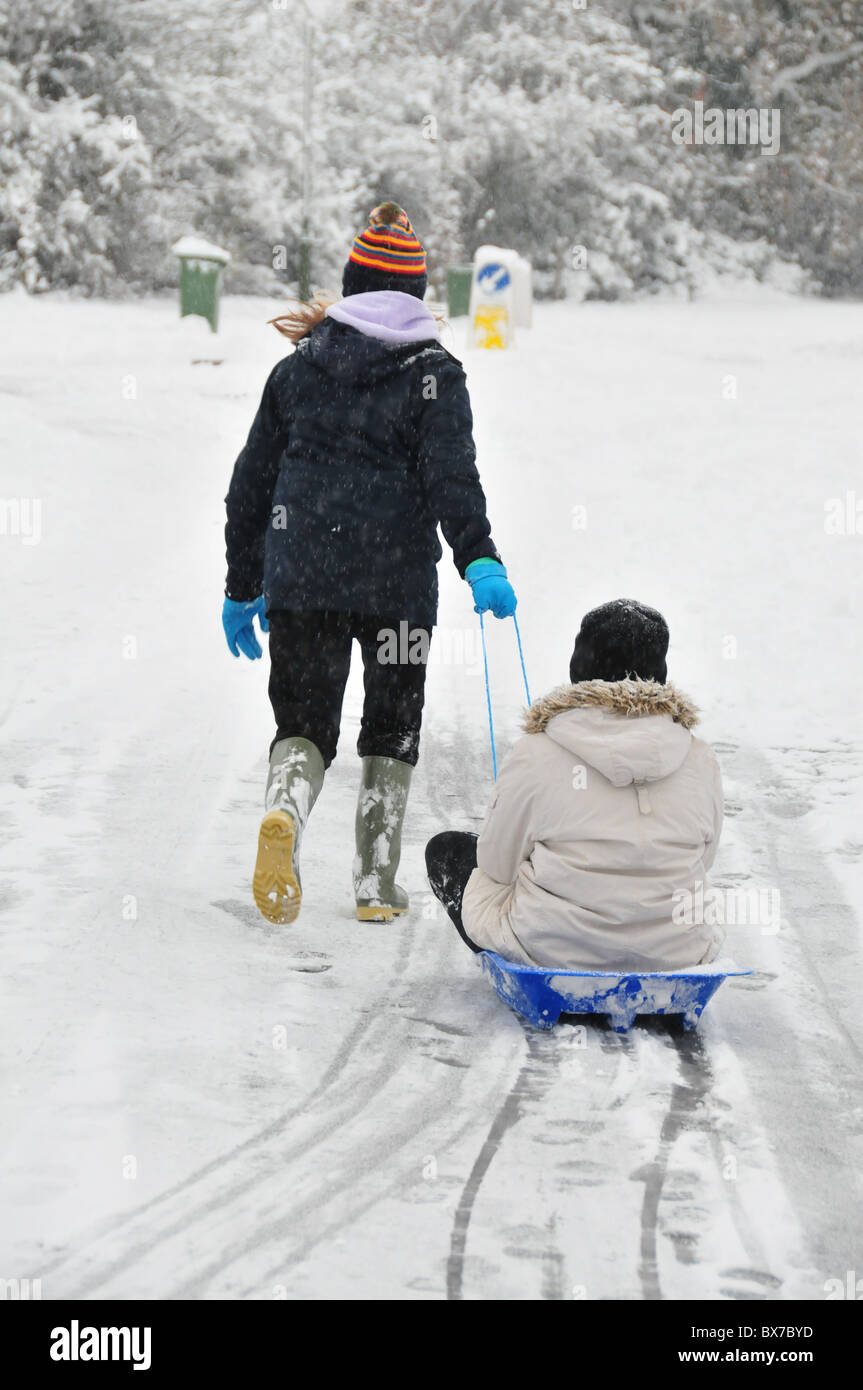 Child pulling sled hi-res stock photography and images - Alamy