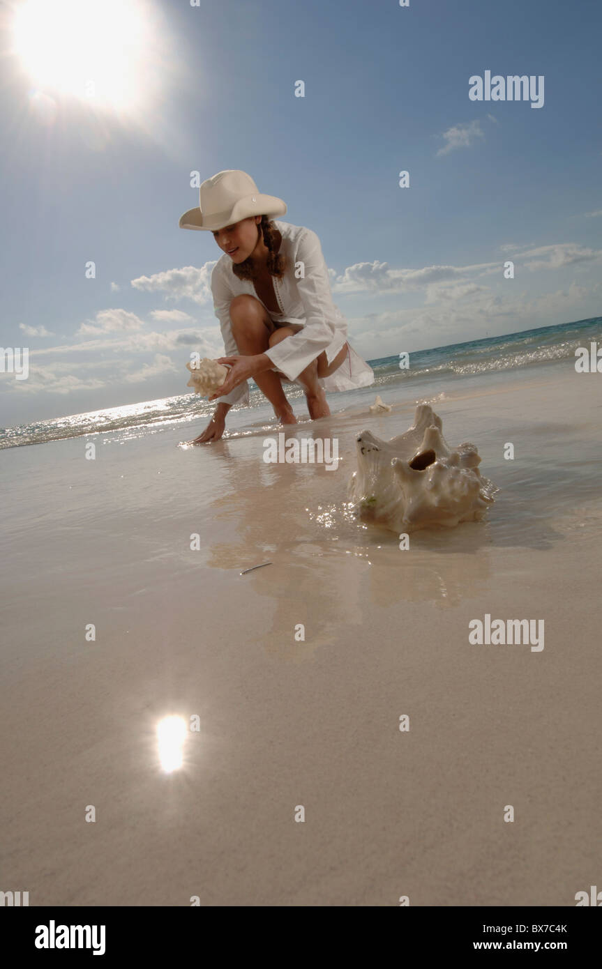 Woman collecting clams Stock Photo - Alamy