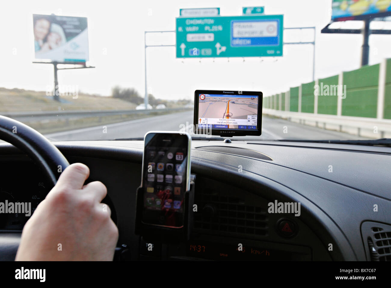 Panasonic Strada GPS navigation and iPhone in a car Stock Photo - Alamy
