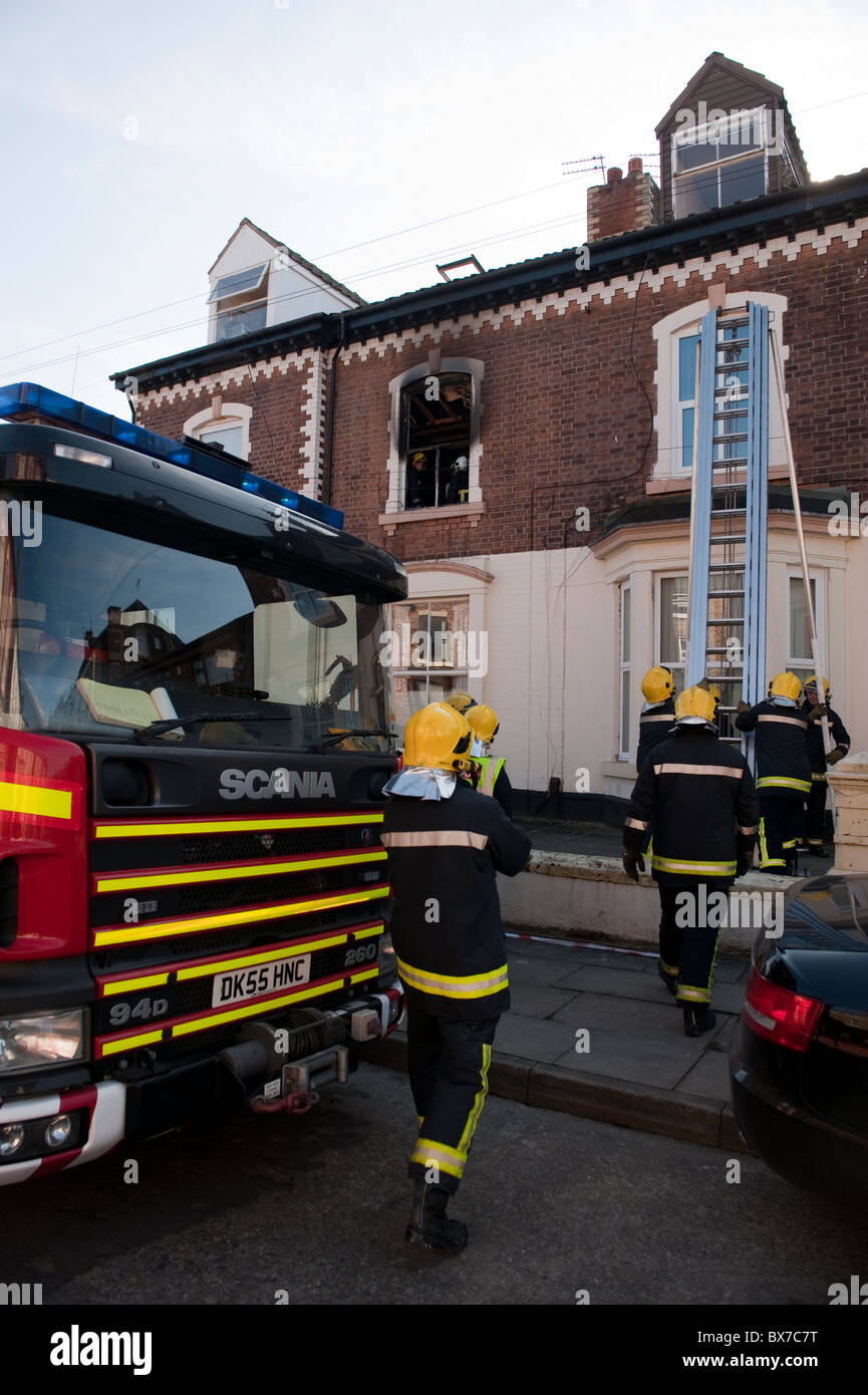 Firemen pitching 135 ladder Fire & Rescue Service UK Stock Photo - Alamy