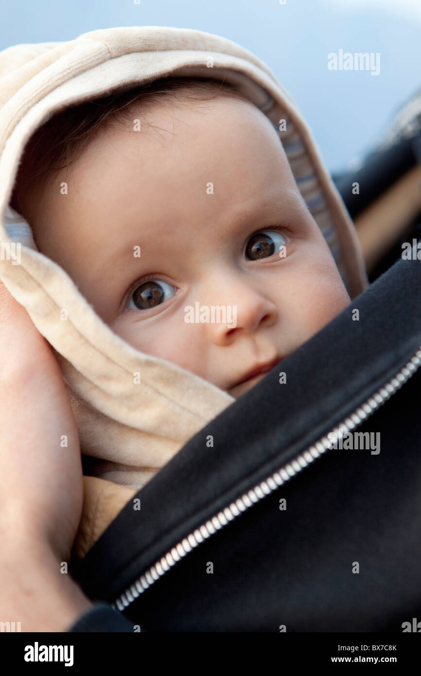 Baby in parent's arms Stock Photo - Alamy