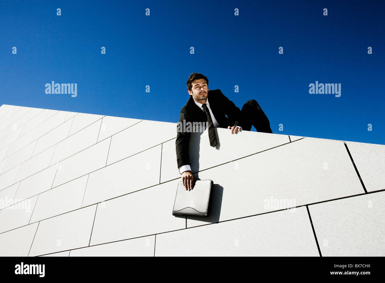 Man on wall Stock Photo - Alamy