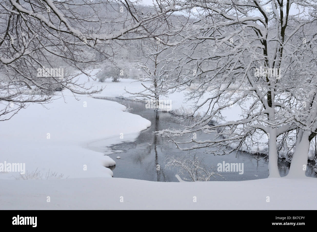 Open river in frozen, cold landscape Stock Photo - Alamy