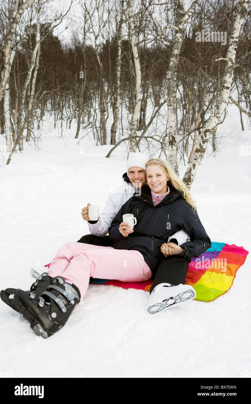 Couple drinking tee Stock Photo - Alamy