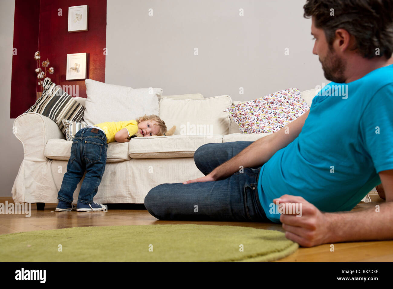 Father watching son Stock Photo - Alamy
