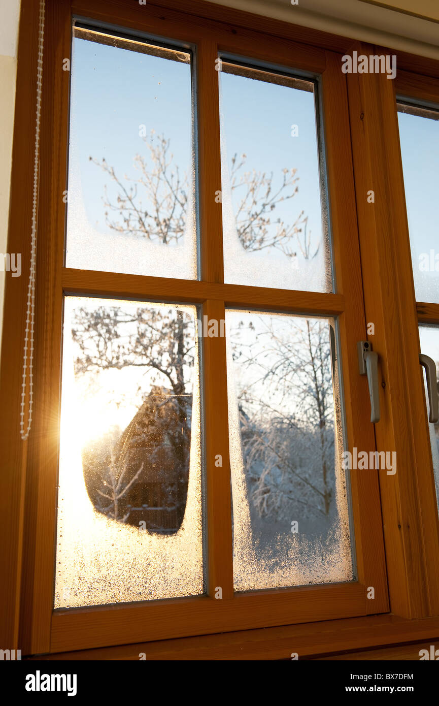 Early morning frosty winter view through a window Stock Photo - Alamy