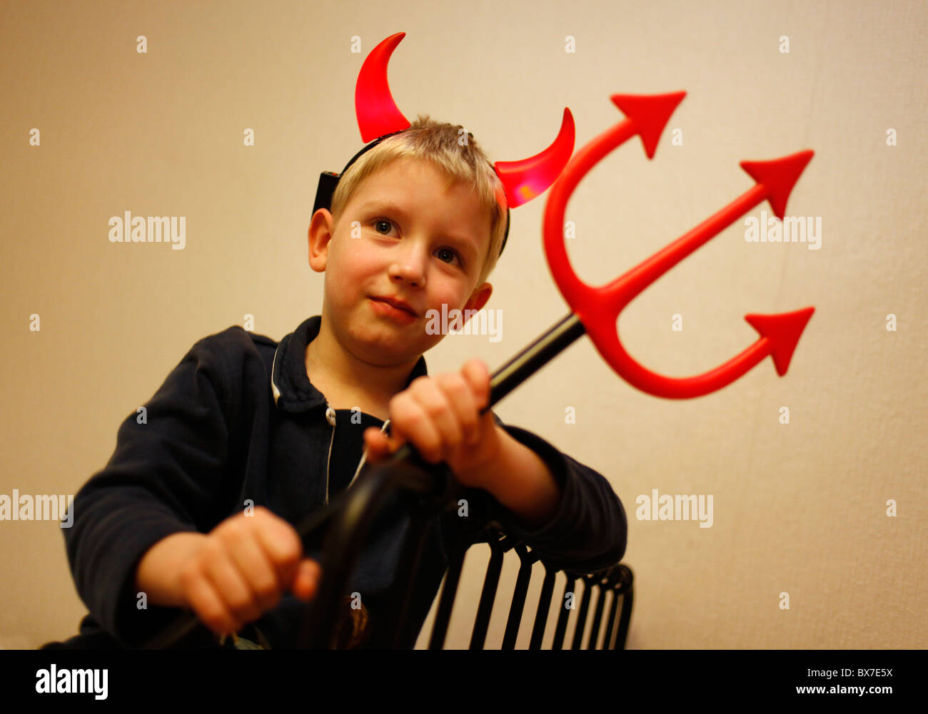 Child boy devil horns trident hi-res stock photography and images - Alamy