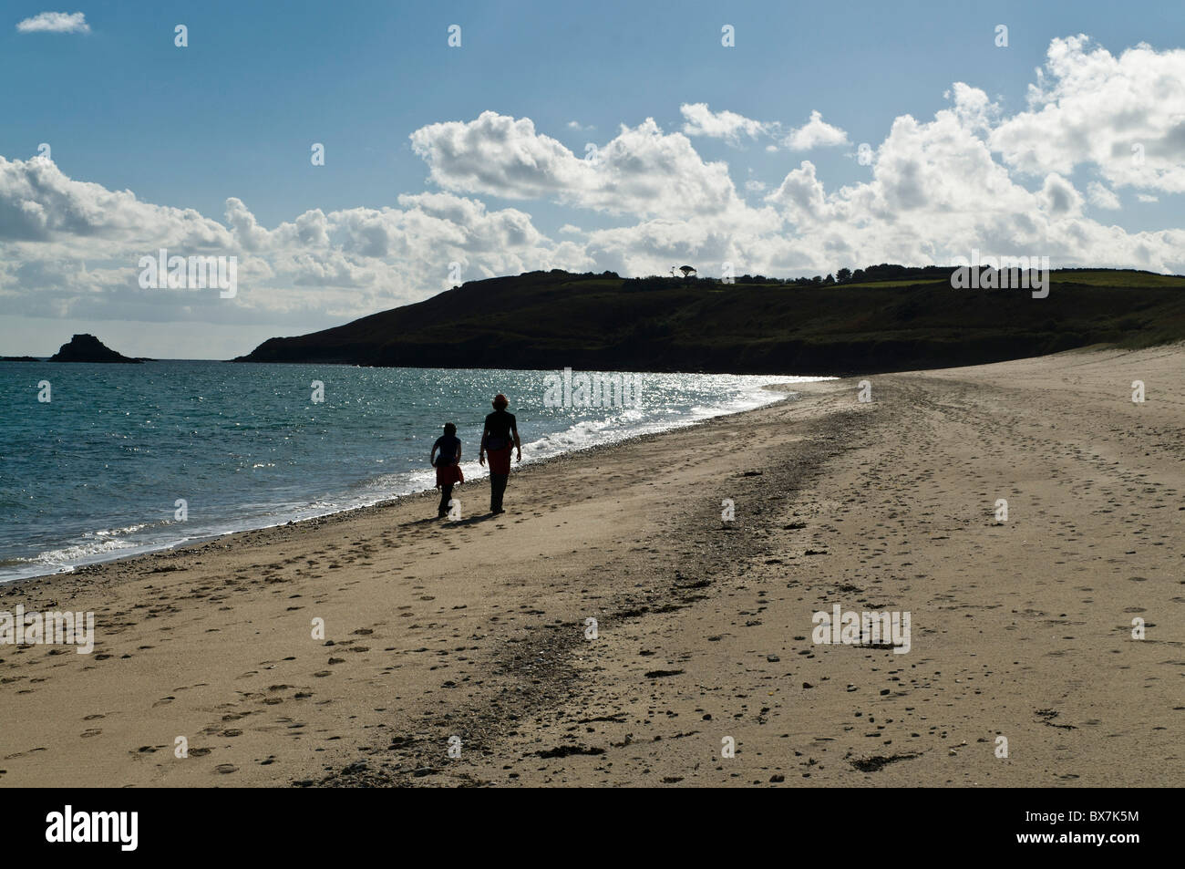 dh Herm Island HERM GUERNSEY Young Couple walking along Shell Beach ...