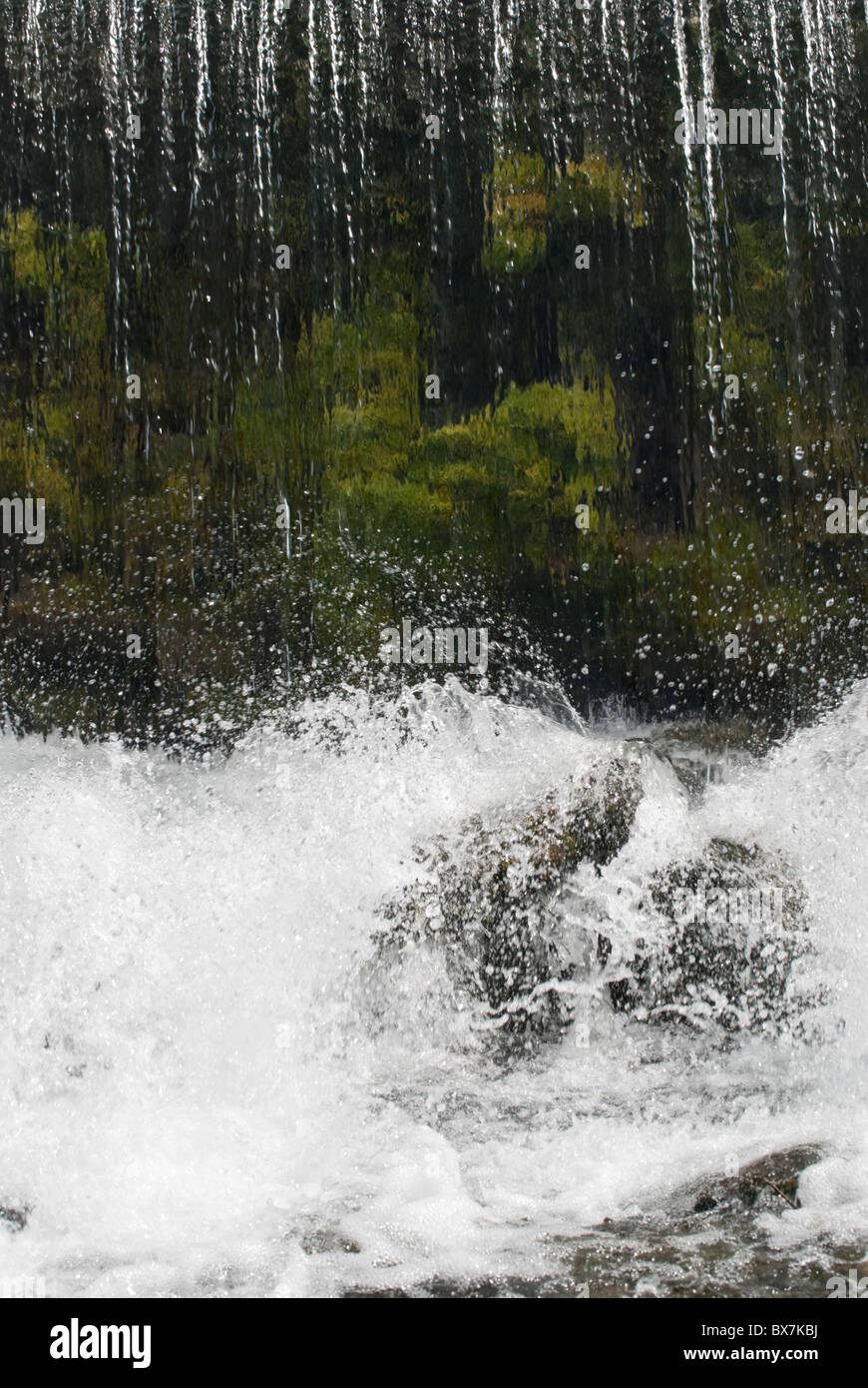 Standing behind a waterfall looking out through the pour at the ...