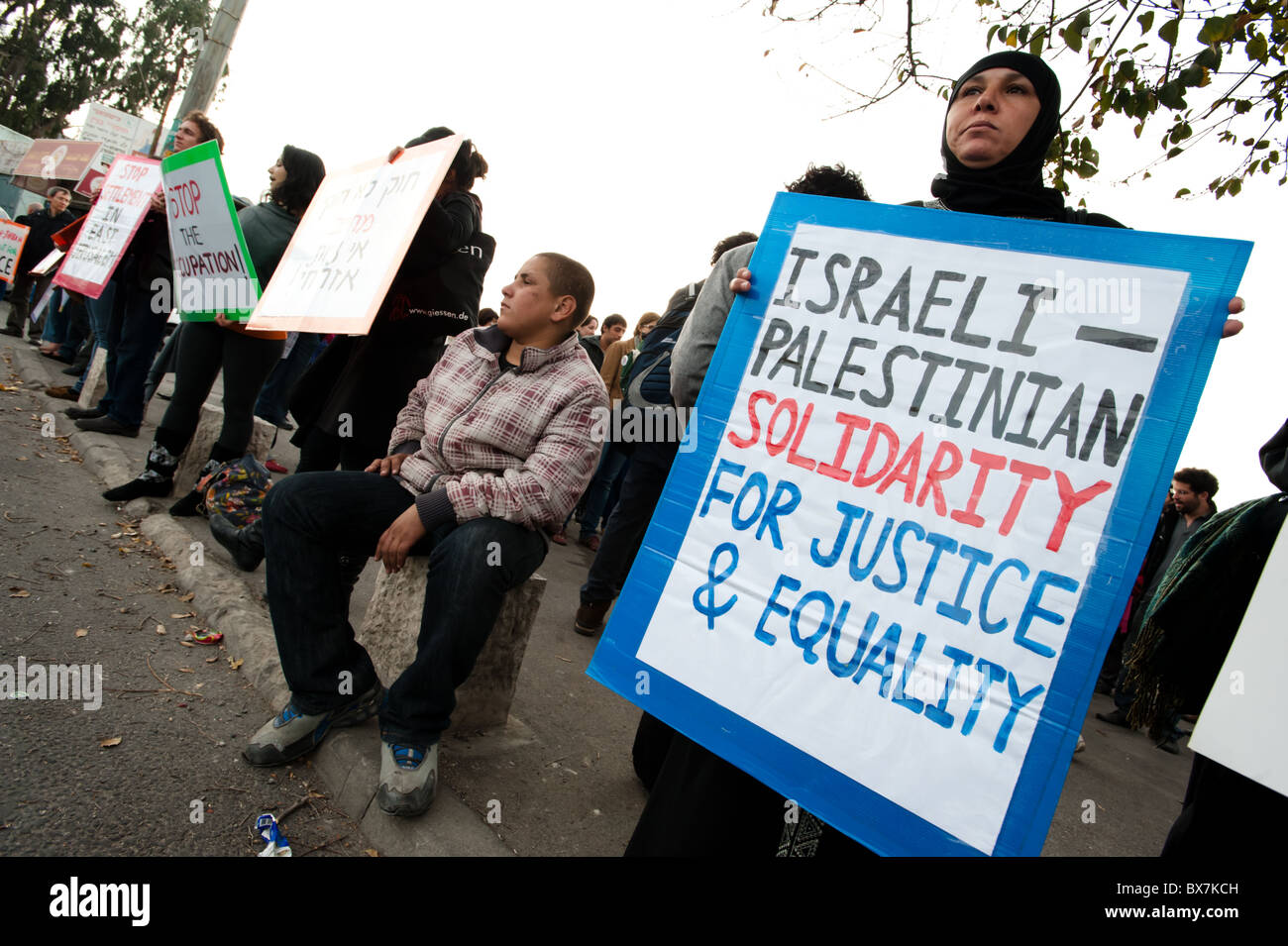 Palestinian, Israeli, and international solidarity activists stage a ...