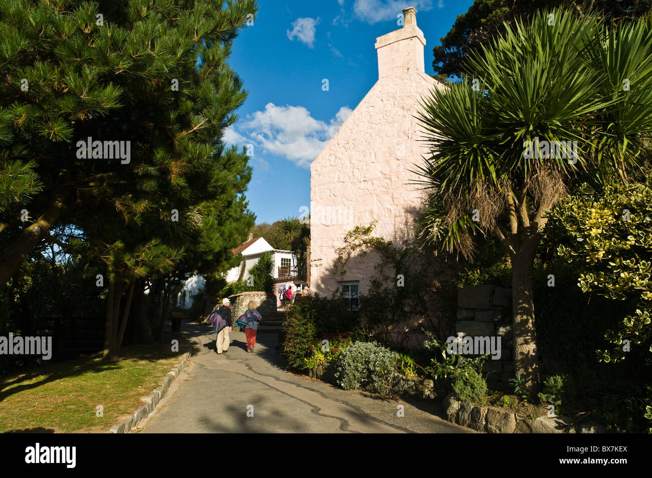 dh Herm Island HERM GUERNSEY Tourists walking along Herm Harbour ...