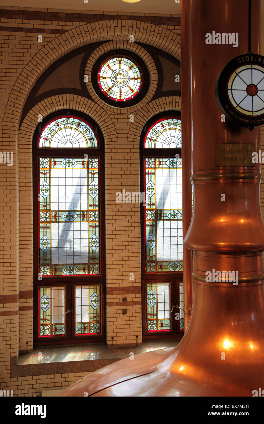Stained glass windows and brewing kettle in Heineken Brewery Stock ...