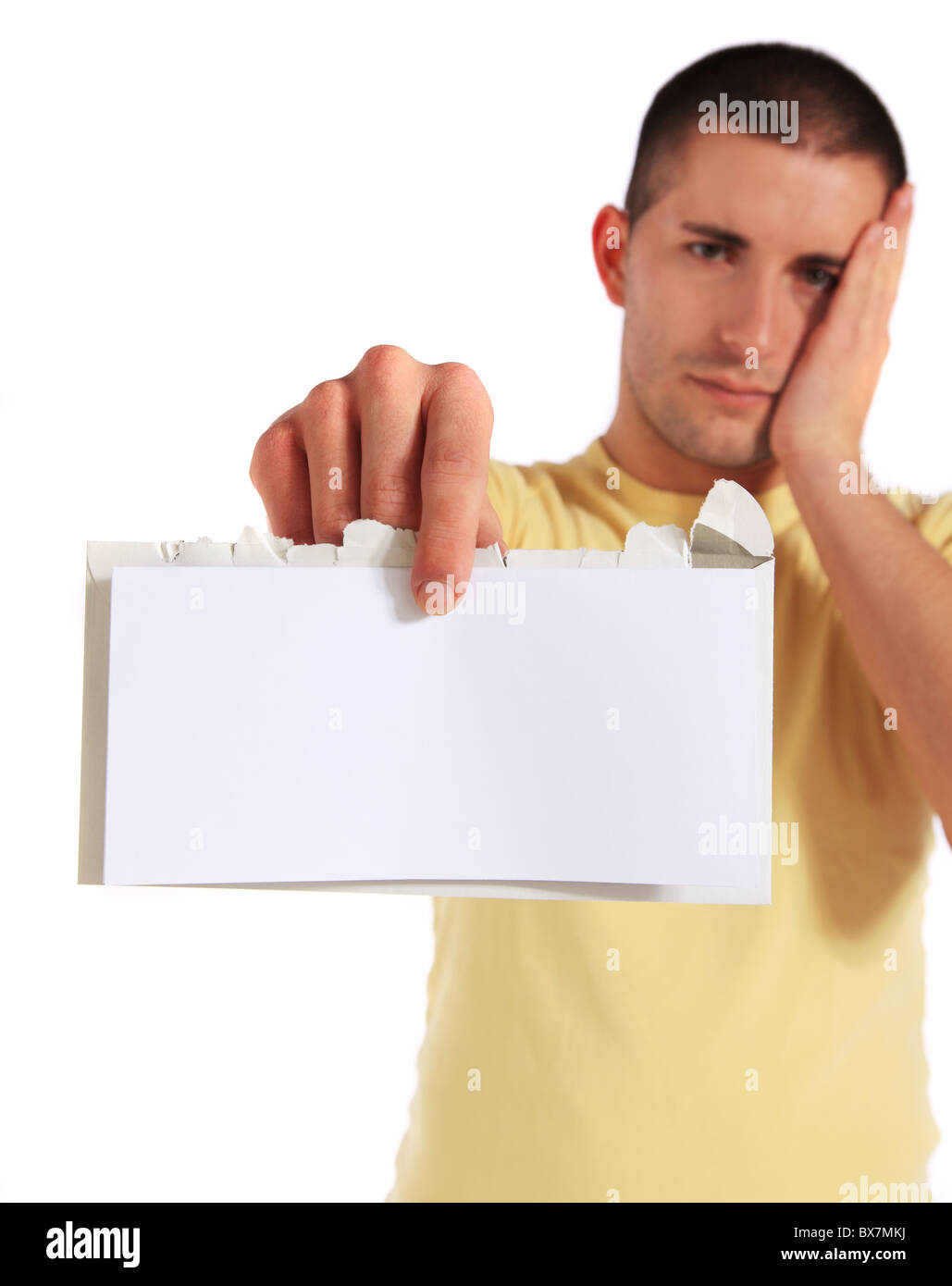 Young man getting bad news. All on white background. Extra copy space ...