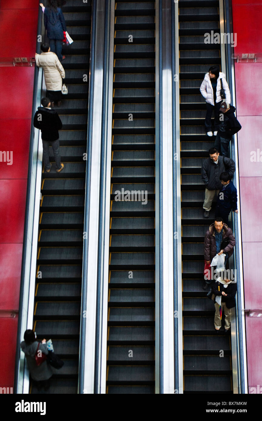 People on triple escalators in Yokohama, Japan Stock Photo - Alamy