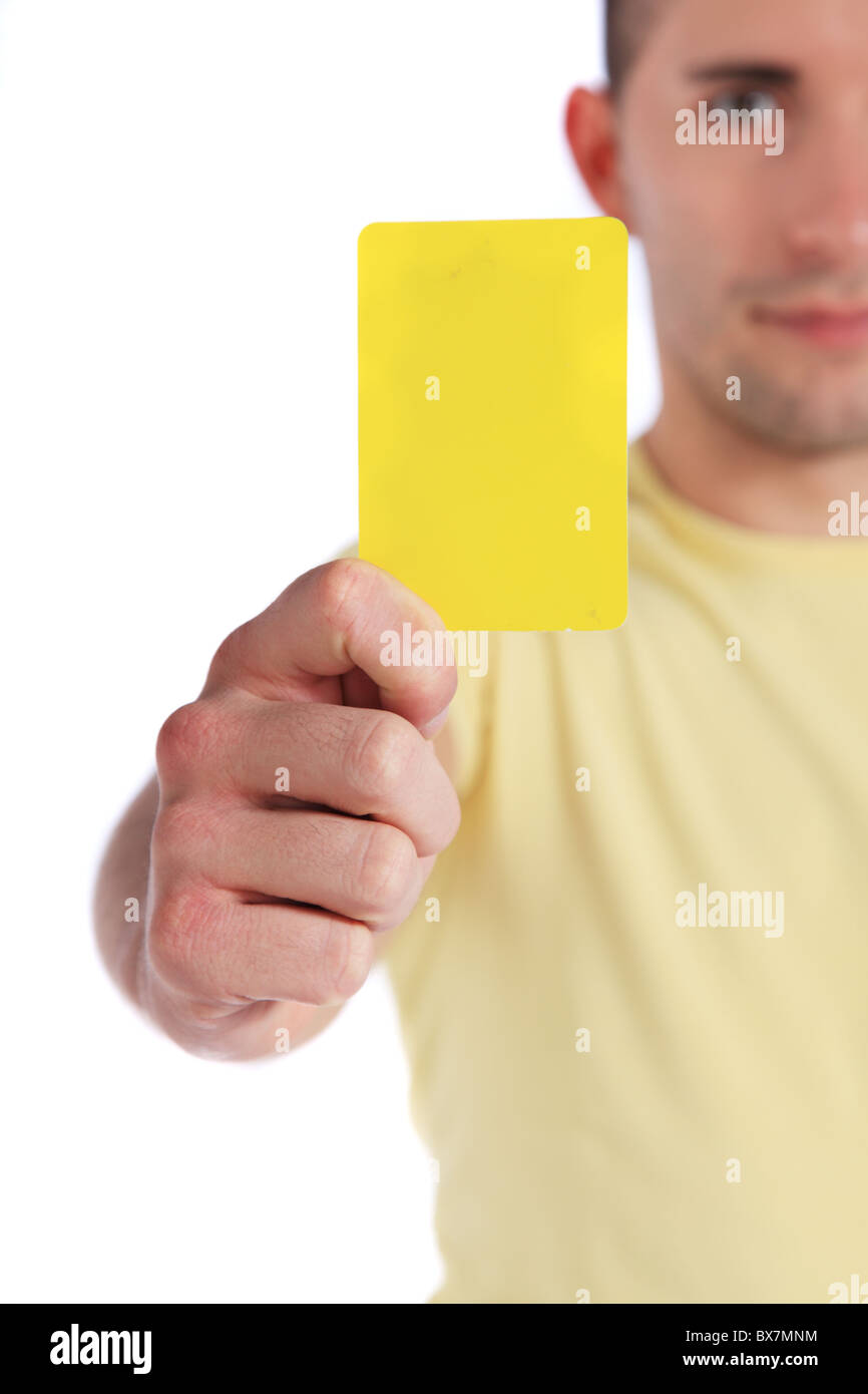 Attractive young man showing yellow card. All on white background Stock ...