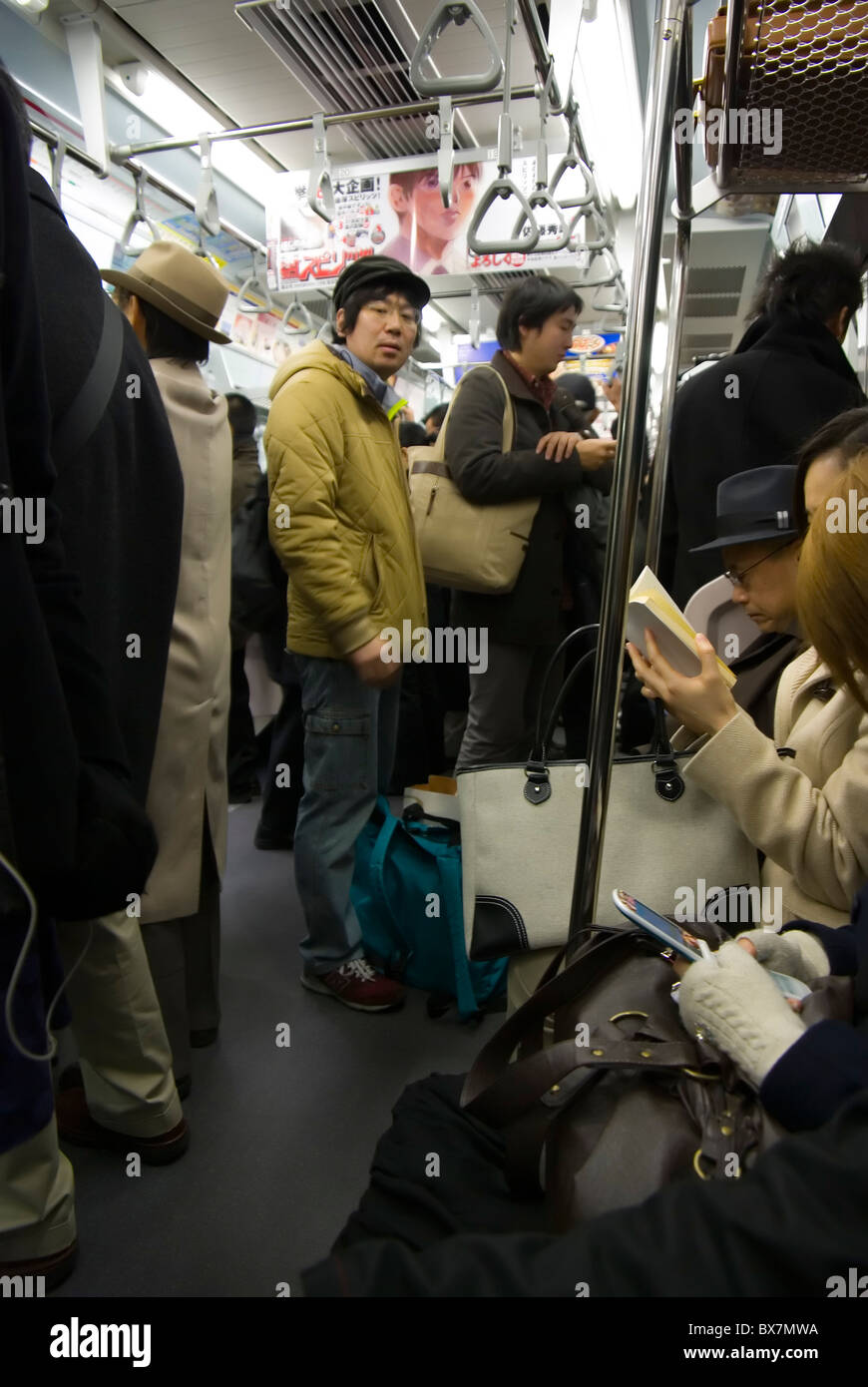 passengers in a train of the tokyo metro Stock Photo - Alamy