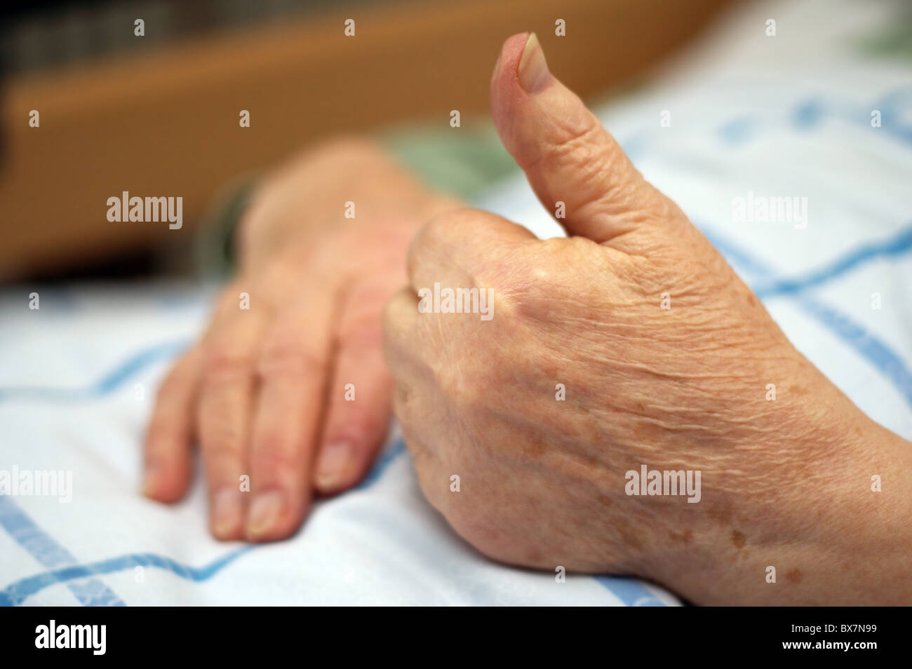 Hands of a care-dependent person making positive gesture Stock Photo ...
