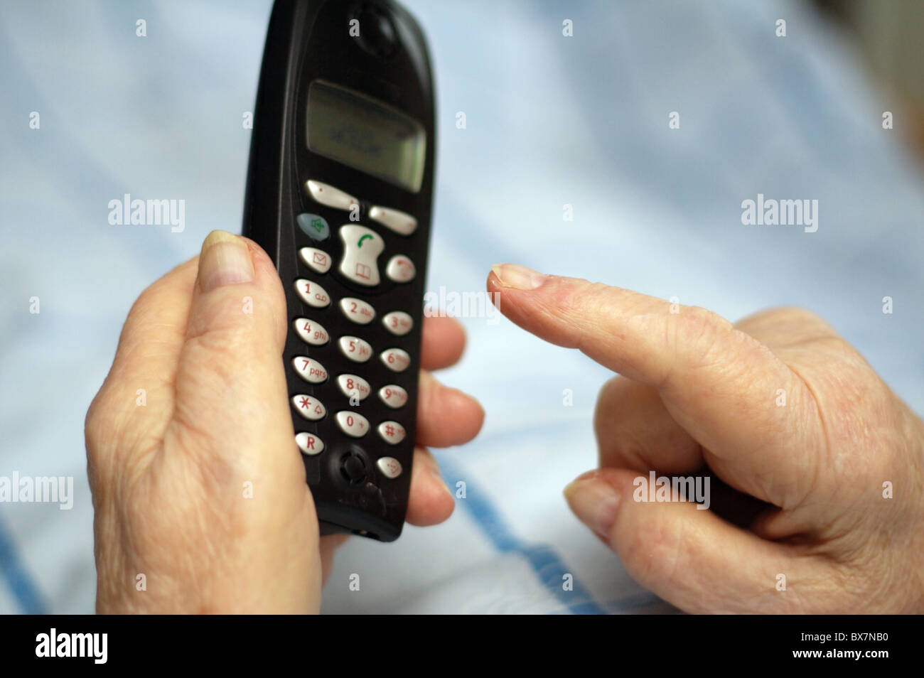 Hands of a care-dependent person making a phone call Stock Photo - Alamy