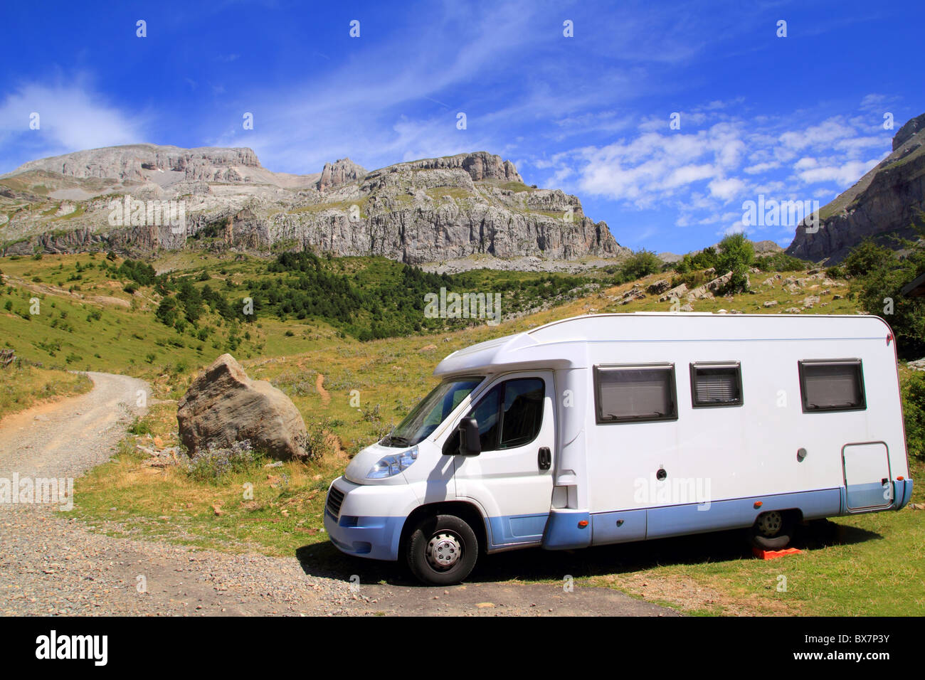 Camper van in mountains blue sky nature sunny outdoor Stock Photo - Alamy