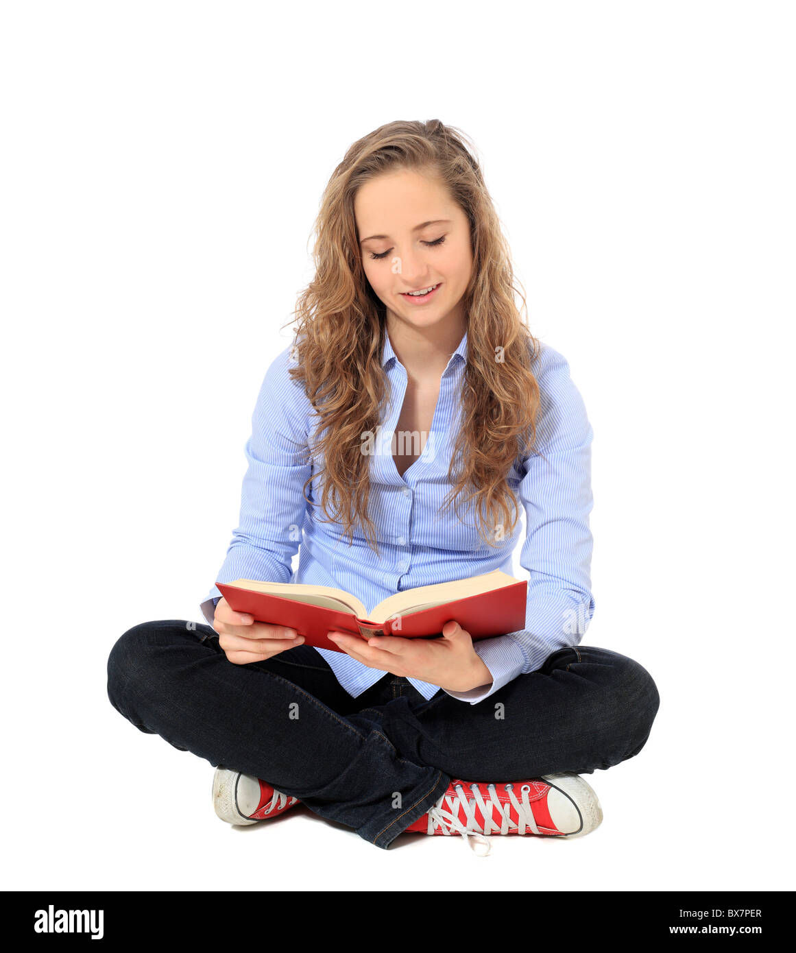 Attractive young girl reading a book. All on white background Stock ...