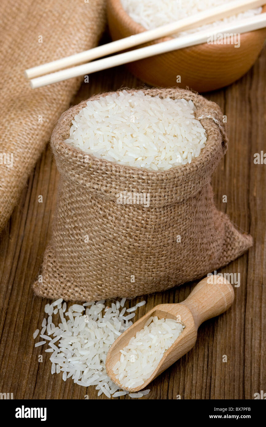 White long rice in small burlap sack Stock Photo - Alamy