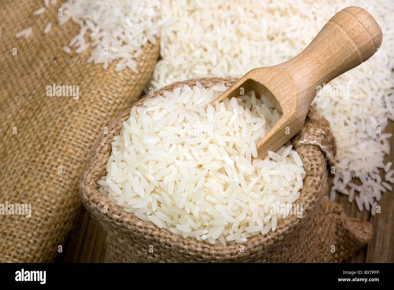 White long rice in small burlap sack Stock Photo - Alamy