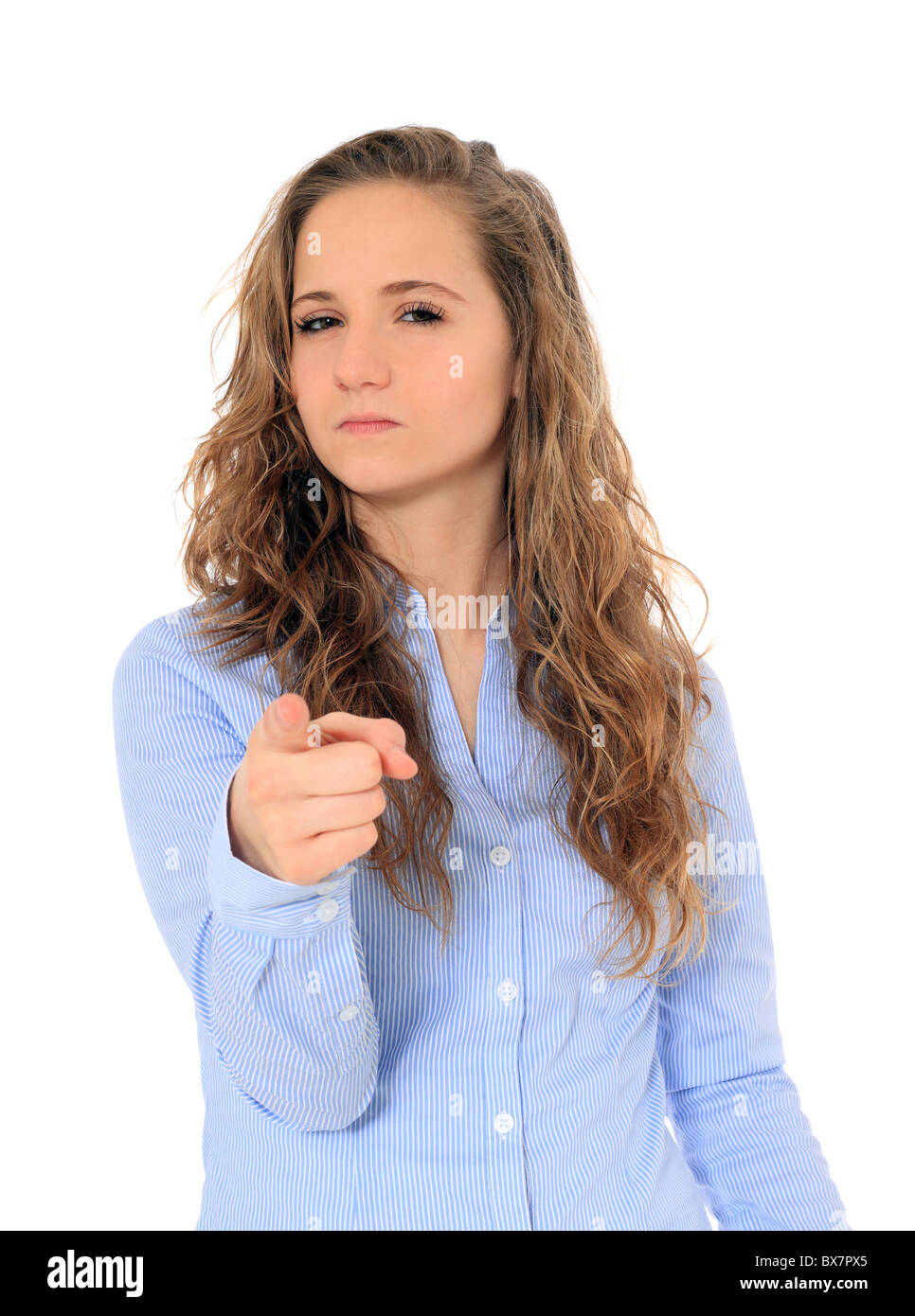 Serious young girl pointing with finger. All on white background Stock ...