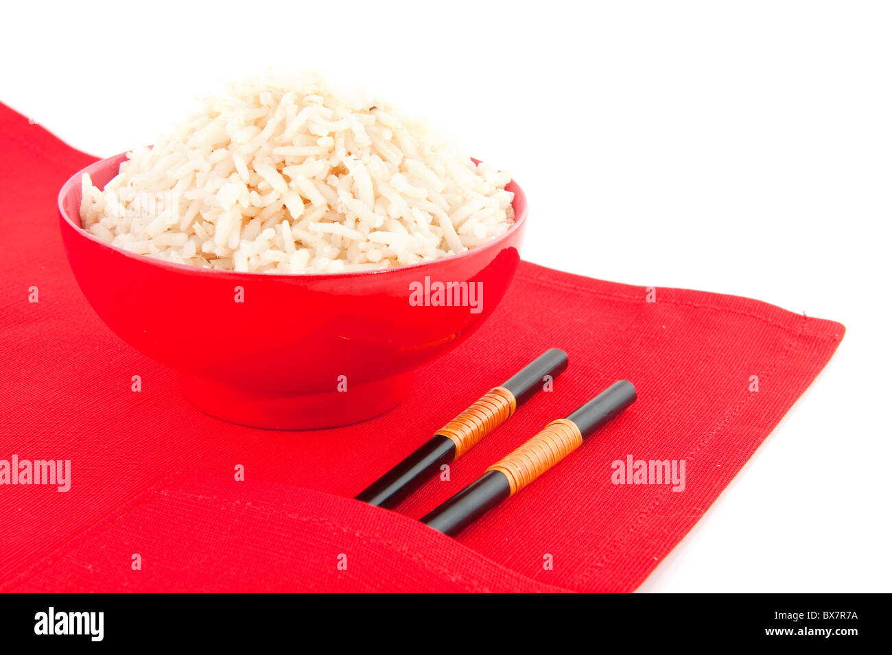 a pair of chop sticks with a bowl rice Stock Photo - Alamy