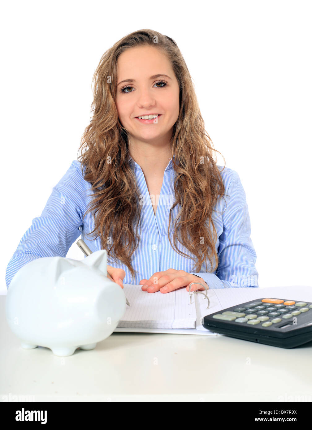 Portrait of an attractive young girl doing her budgeting. All on white ...