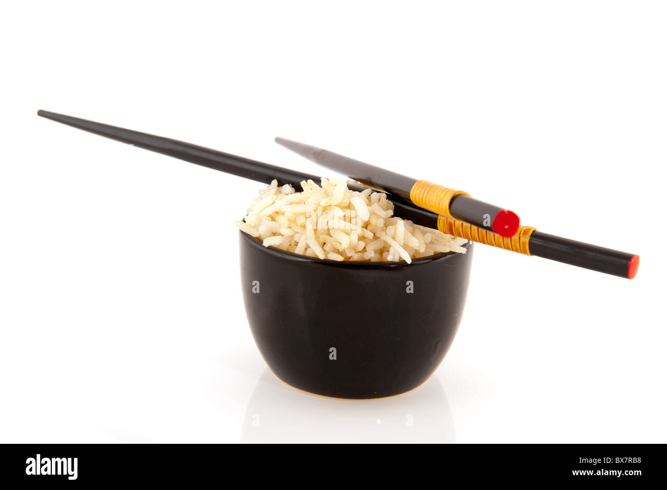 Japanese rice in black bowl with chop sticks Stock Photo - Alamy