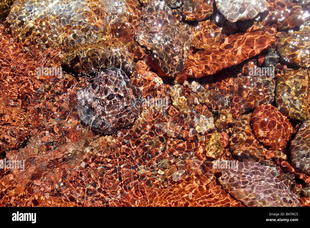 river water bottom stream red rocks transparency texture background ...