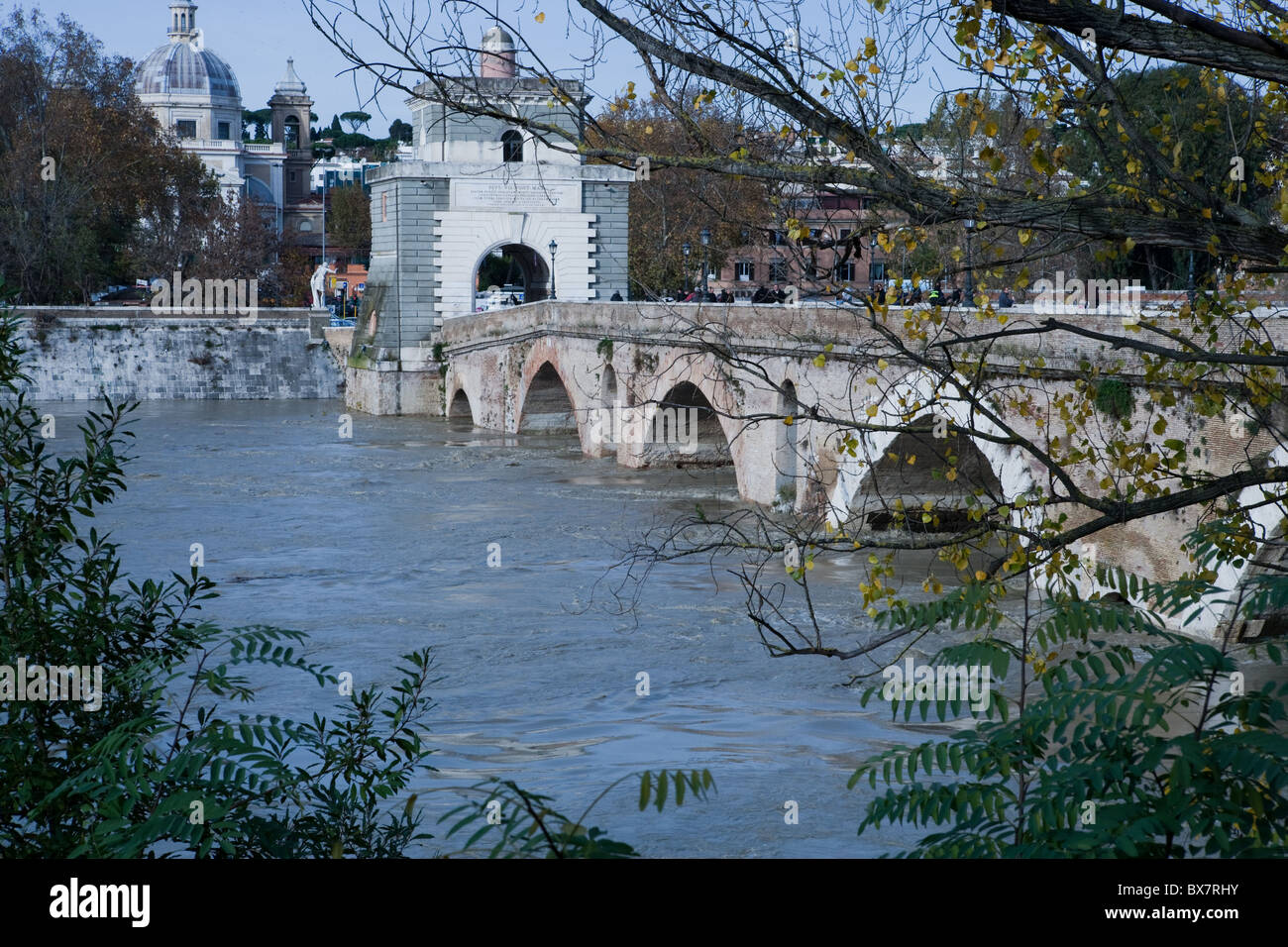 Tiber river full high water in Ponte Milvio bridge raining Rome Italy ...
