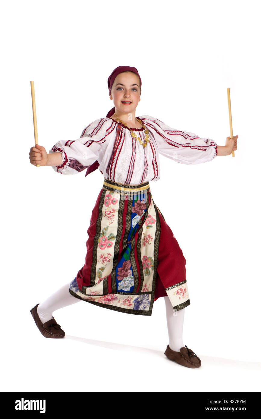 Studio shot of young girl in colourful Romanian national folk dancing ...