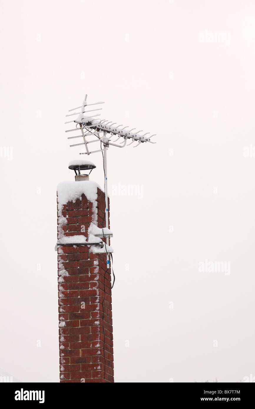 snow covered television aerial attached to chimney Stock Photo - Alamy
