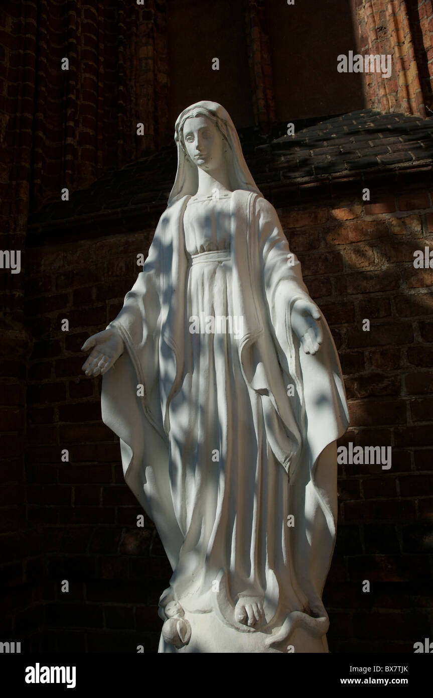 A statue of the Virgin Mary in the shadows of the midday sun Stock ...