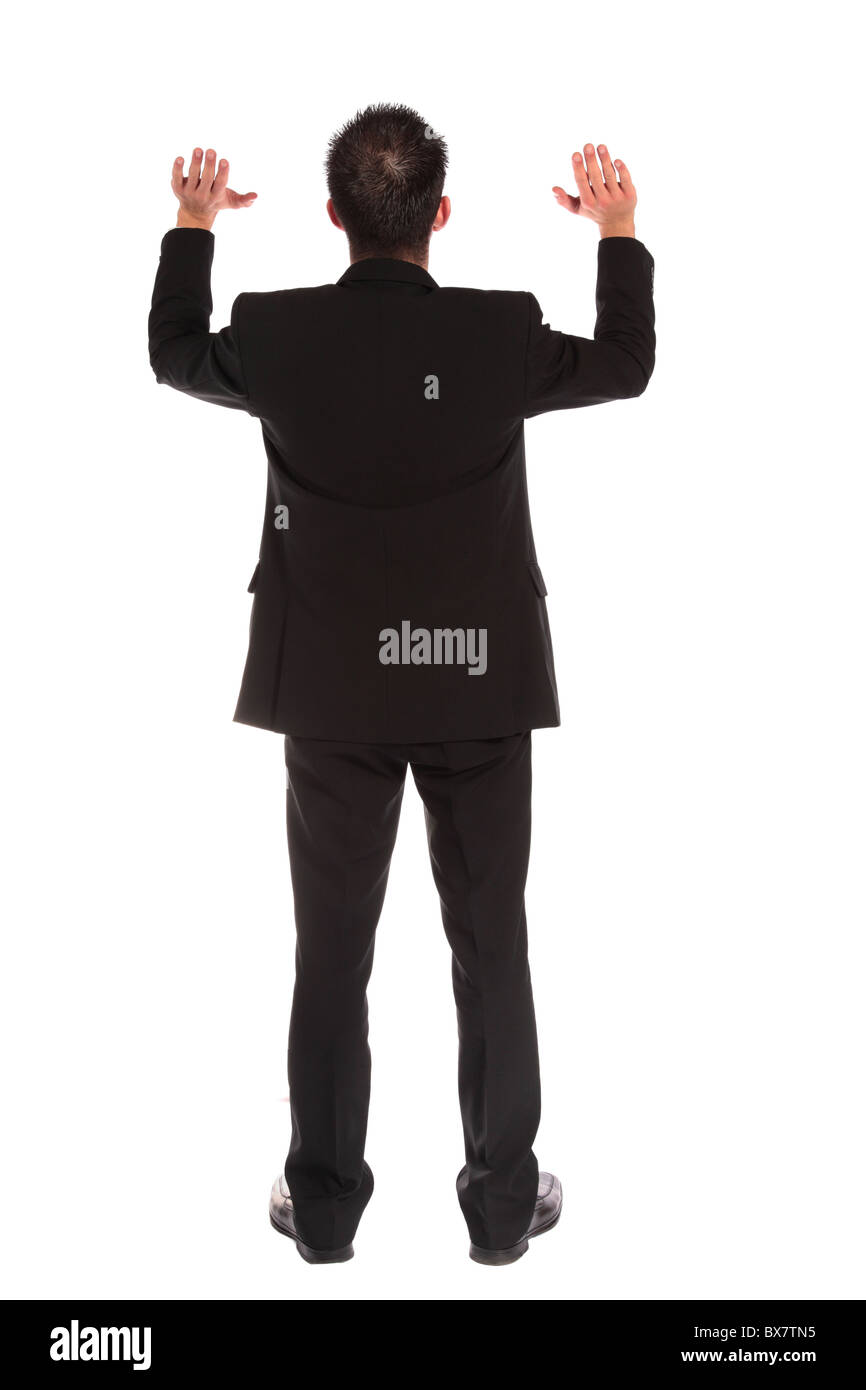 Back view of a businessman lifting his arms. Image with extra copy ...