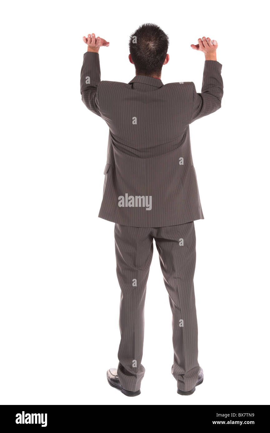 Back view of a businessman lifting his arms. Image with extra copy ...