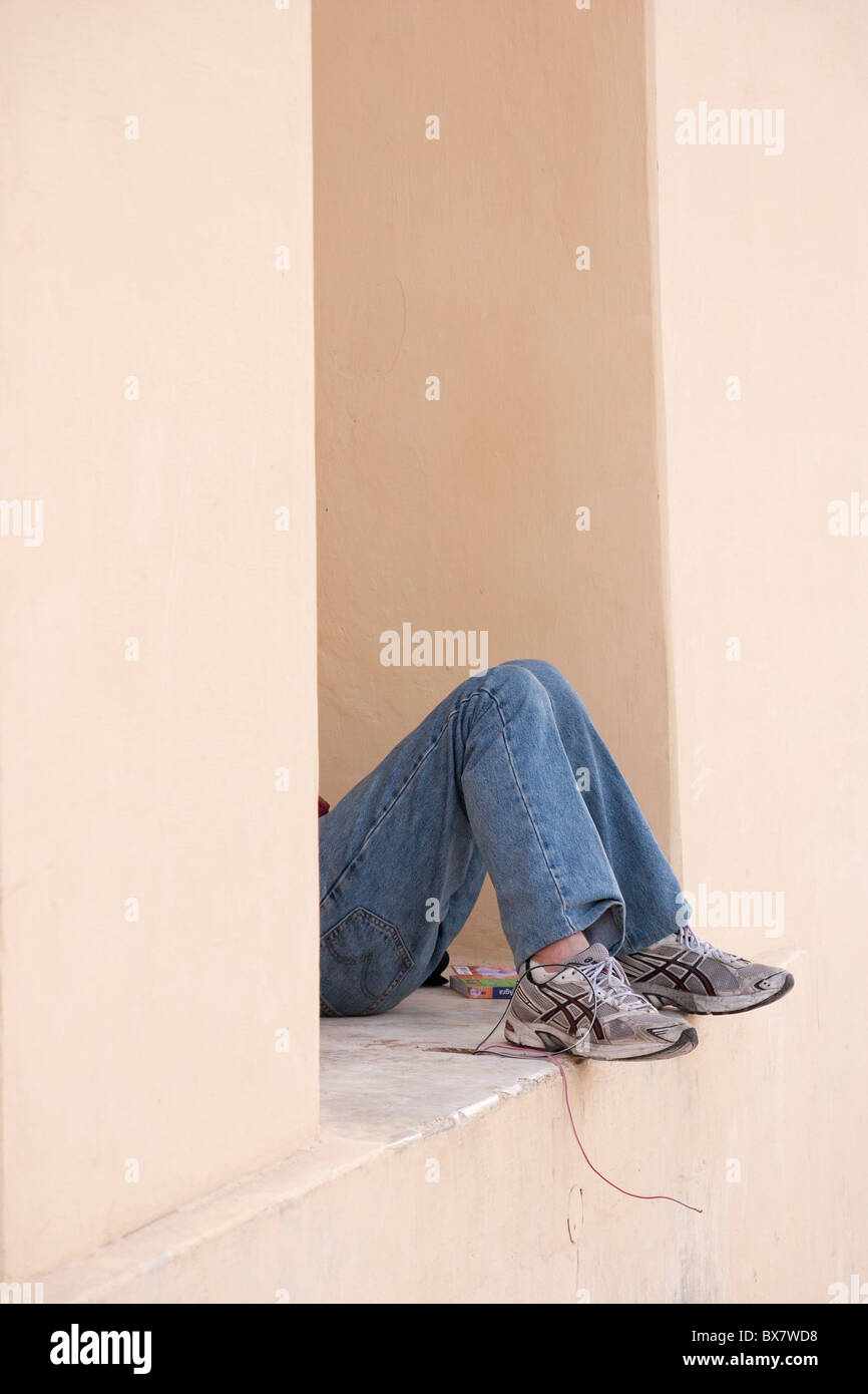 Tired tourist resting at Indian temple Stock Photo - Alamy