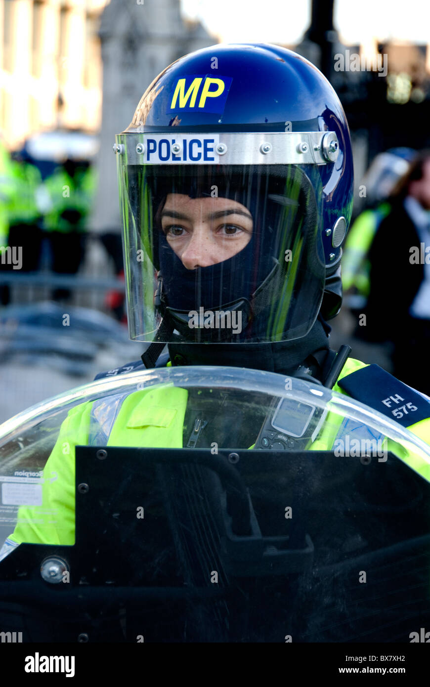 Female riot policewoman policing an student protest London 9.12.10 ...