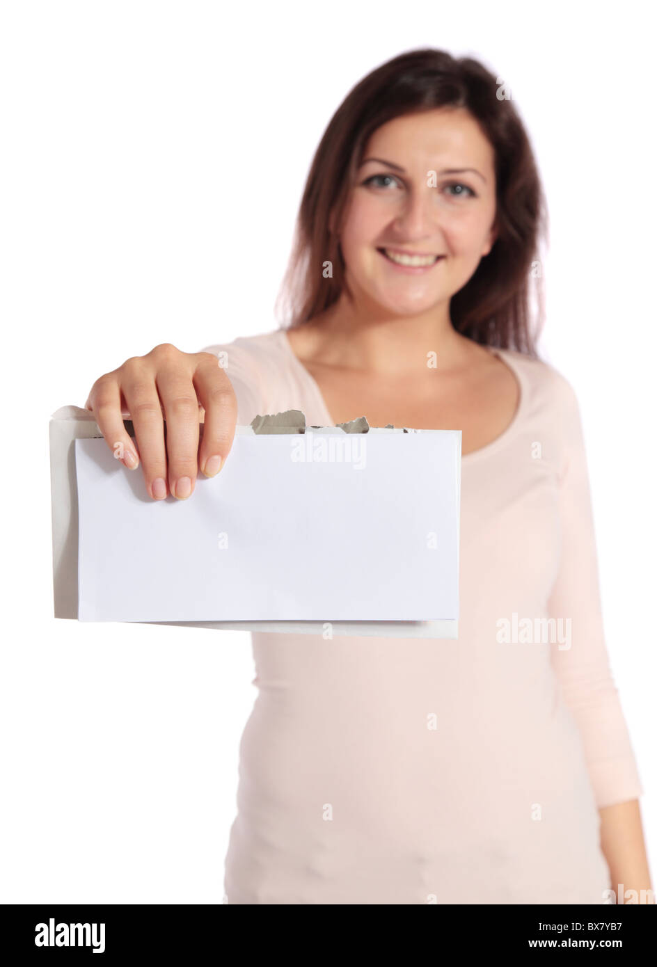 Attractive young woman holding a letter. Focus on letter. Extra copy ...