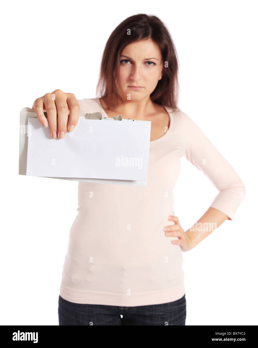 Angry young woman holding a letter. Focus on letter. Extra copy space ...