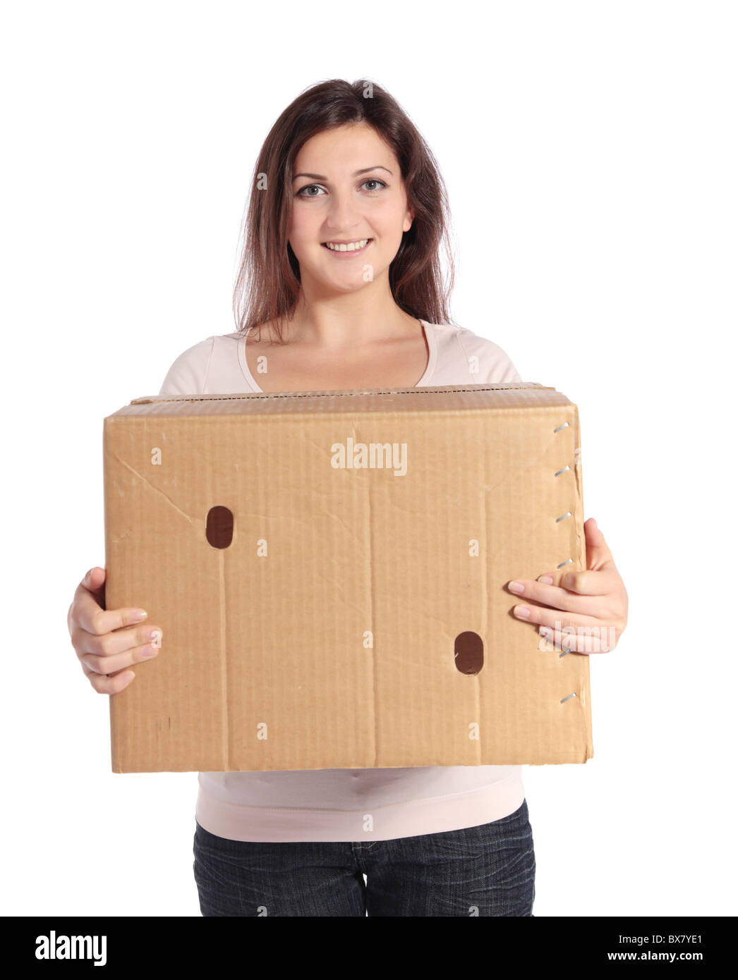 Attractive young woman carrying a moving box. All isolated on white ...