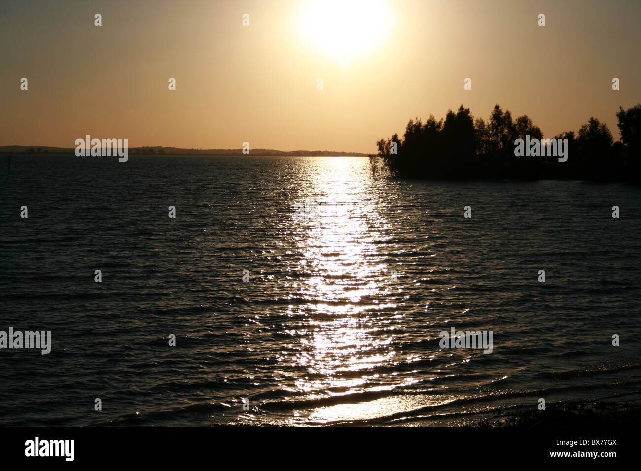 Sunset over Misty Bay Stock Photo - Alamy