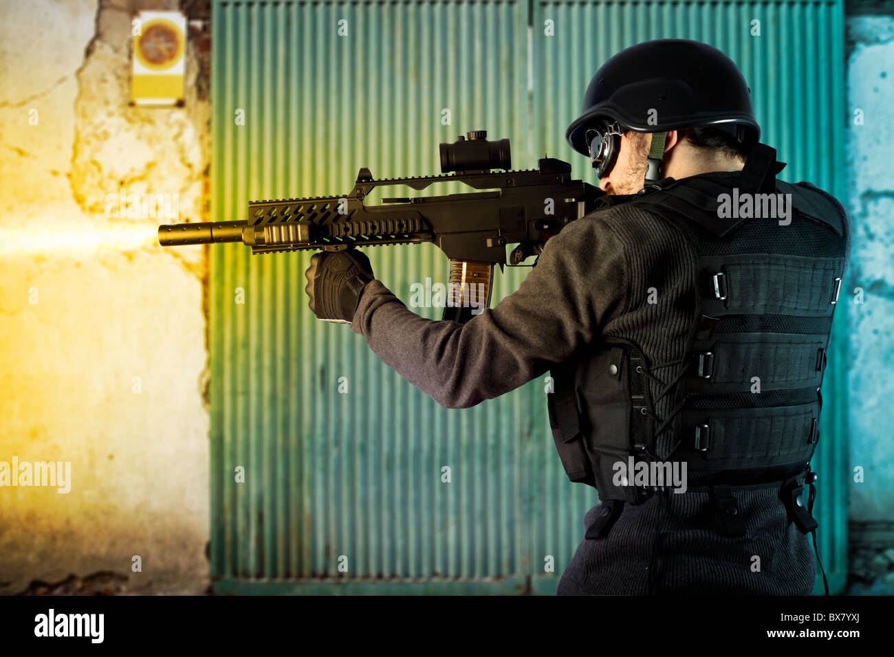 Street Assault, riot police firing his submachine gun Stock Photo - Alamy