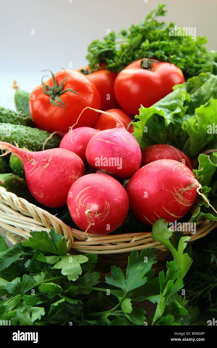 Fresh vegetables and herbs mix in a wicker basket Stock Photo - Alamy