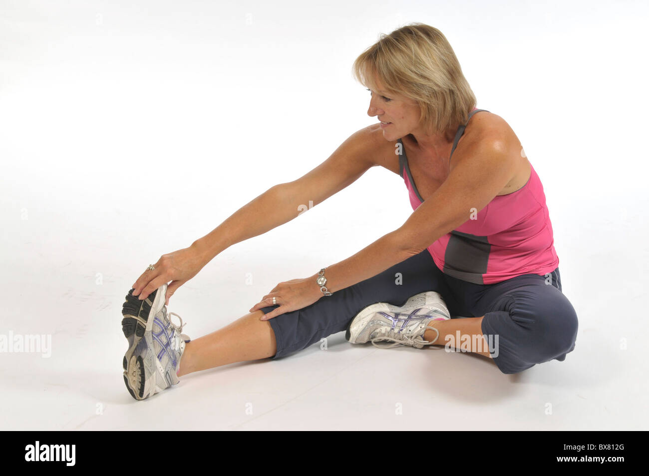 50 yr old demonstrating advanced seated hamstring stretch Stock Photo ...