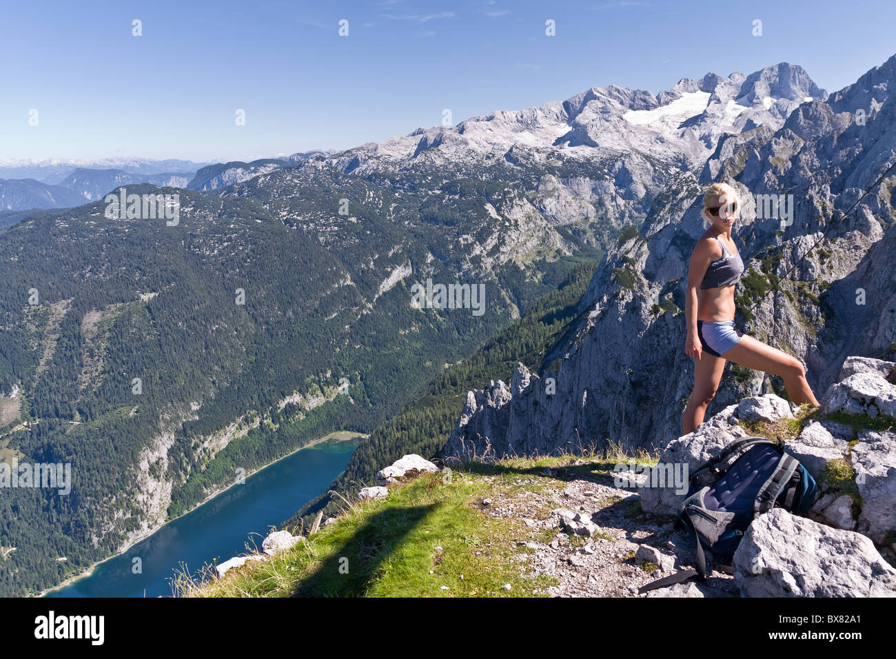 young female on the top of the alpine peak Stock Photo - Alamy