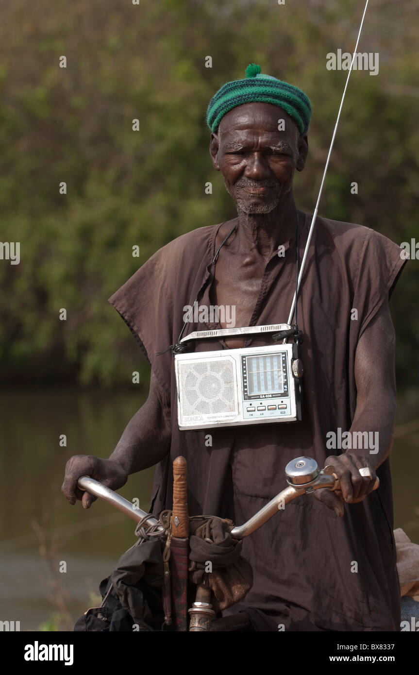 African senior with a transistor radio around his neck. Mali, West ...