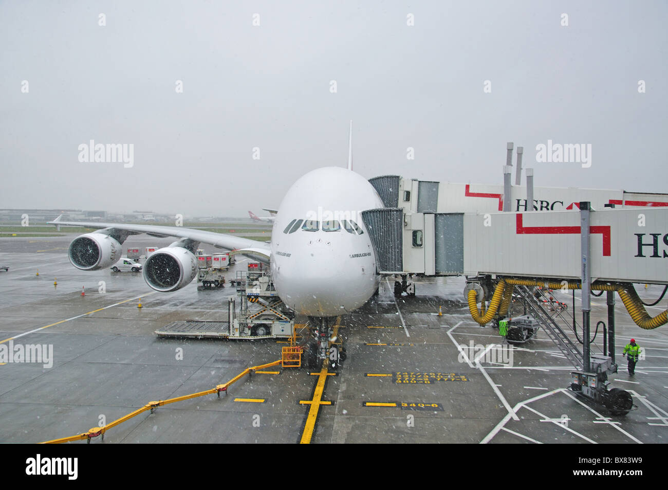 Emirates A380 Airbus on stand in bad weather, Heathrow Airport. Borough ...